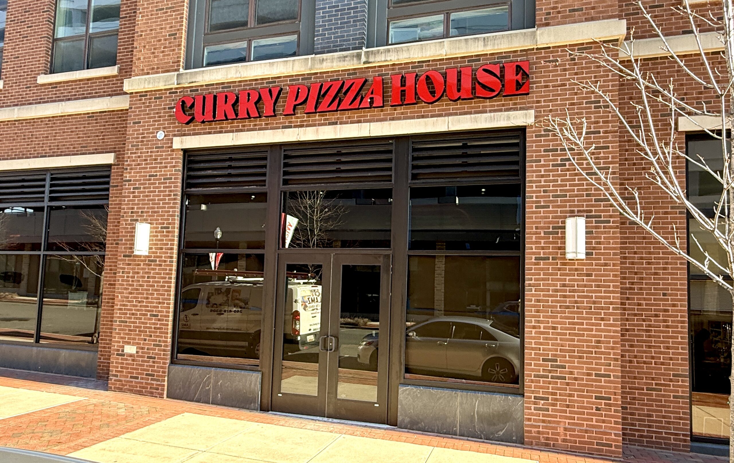 Sign installed at new Curry Pizza House in Loudoun